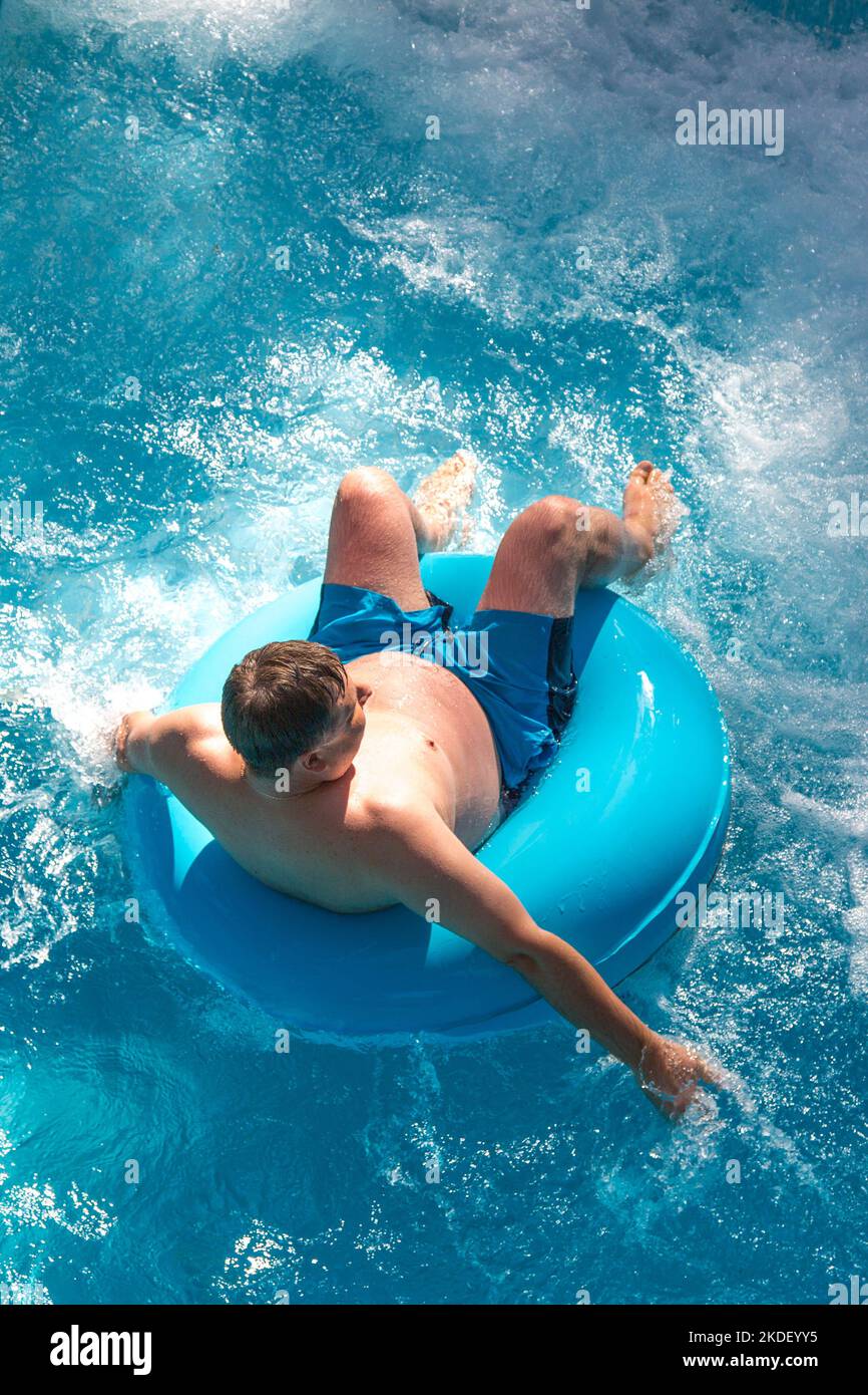 Overweight european tourist in aerial lap water park swims pool Stock ...