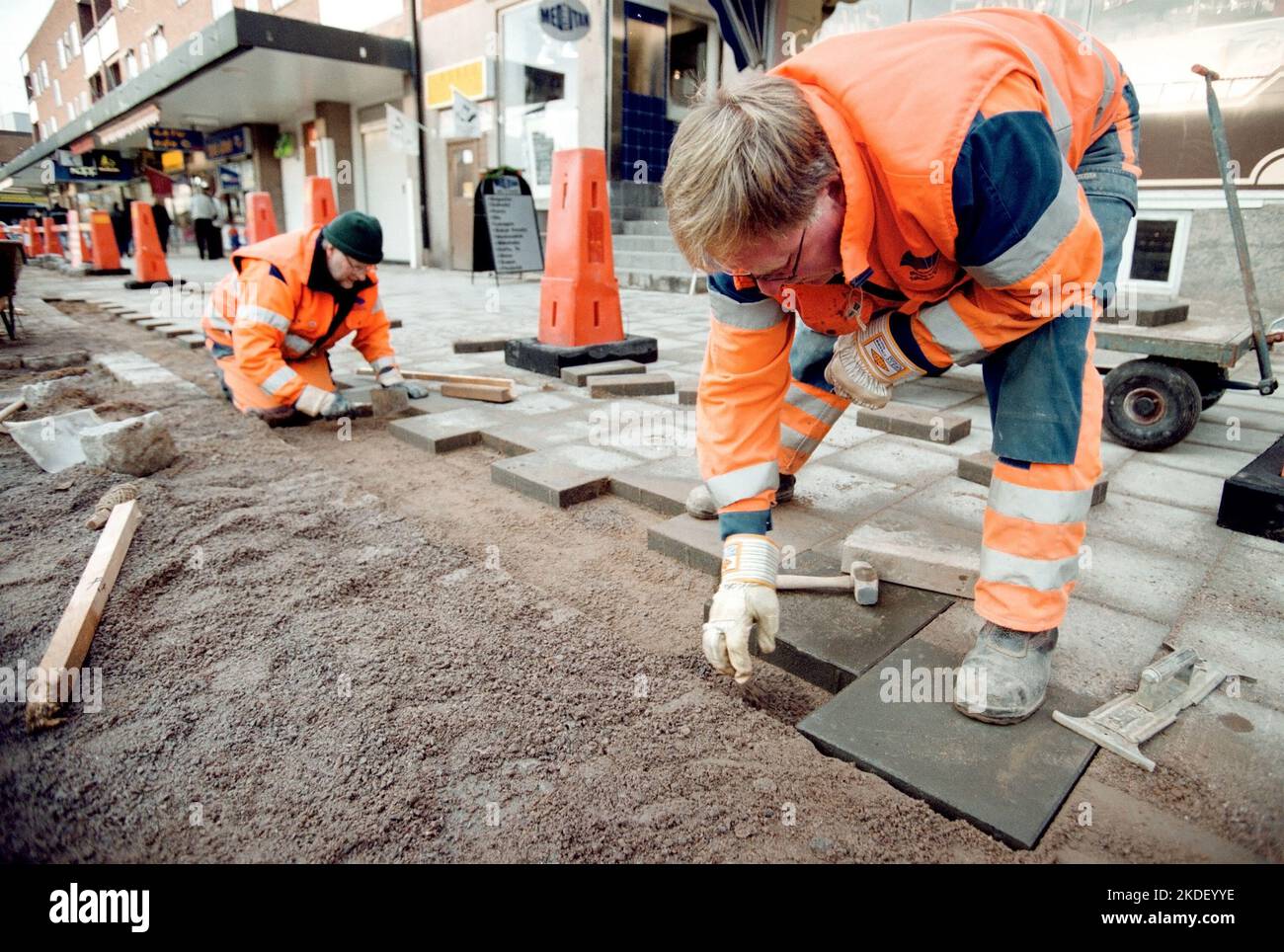 A business in a municipality. Street works with paving of pavements ...