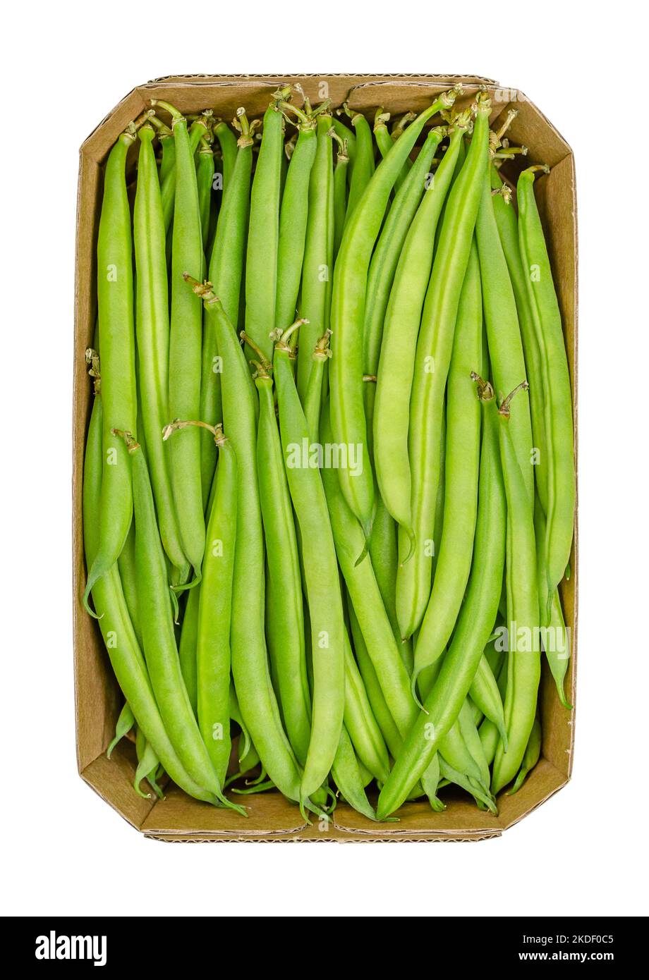 Fresh green beans in a cardboard punnet. Young, unripe fruits of a ...