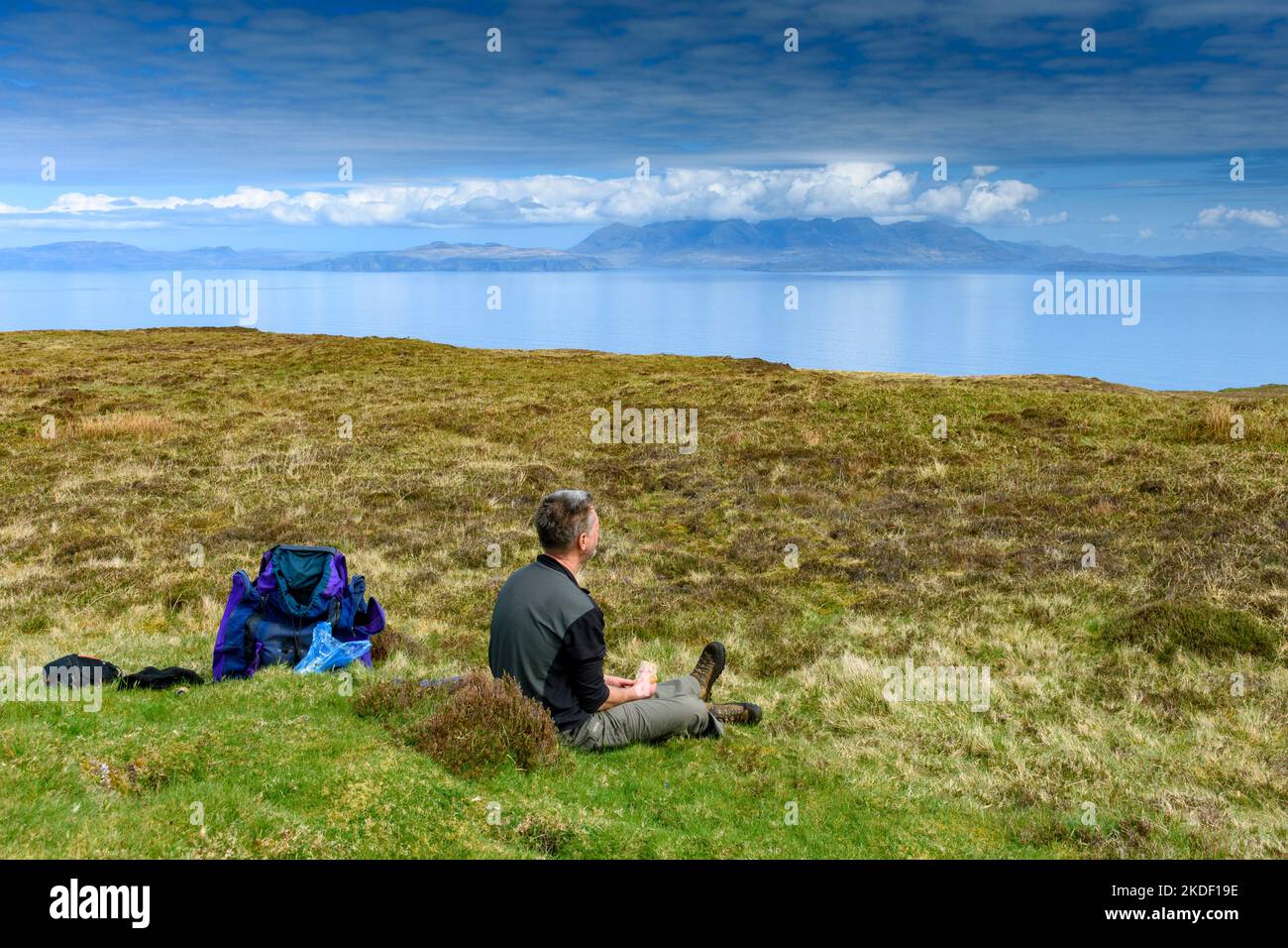 A walker at the summit of Carn a' Ghaill, the highest point of the Isle ...