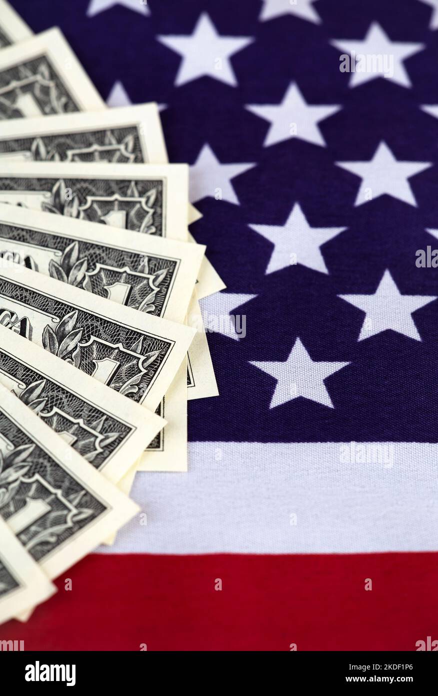 US dollar bills on a flag. Inflation, finance or money savings vertical ...