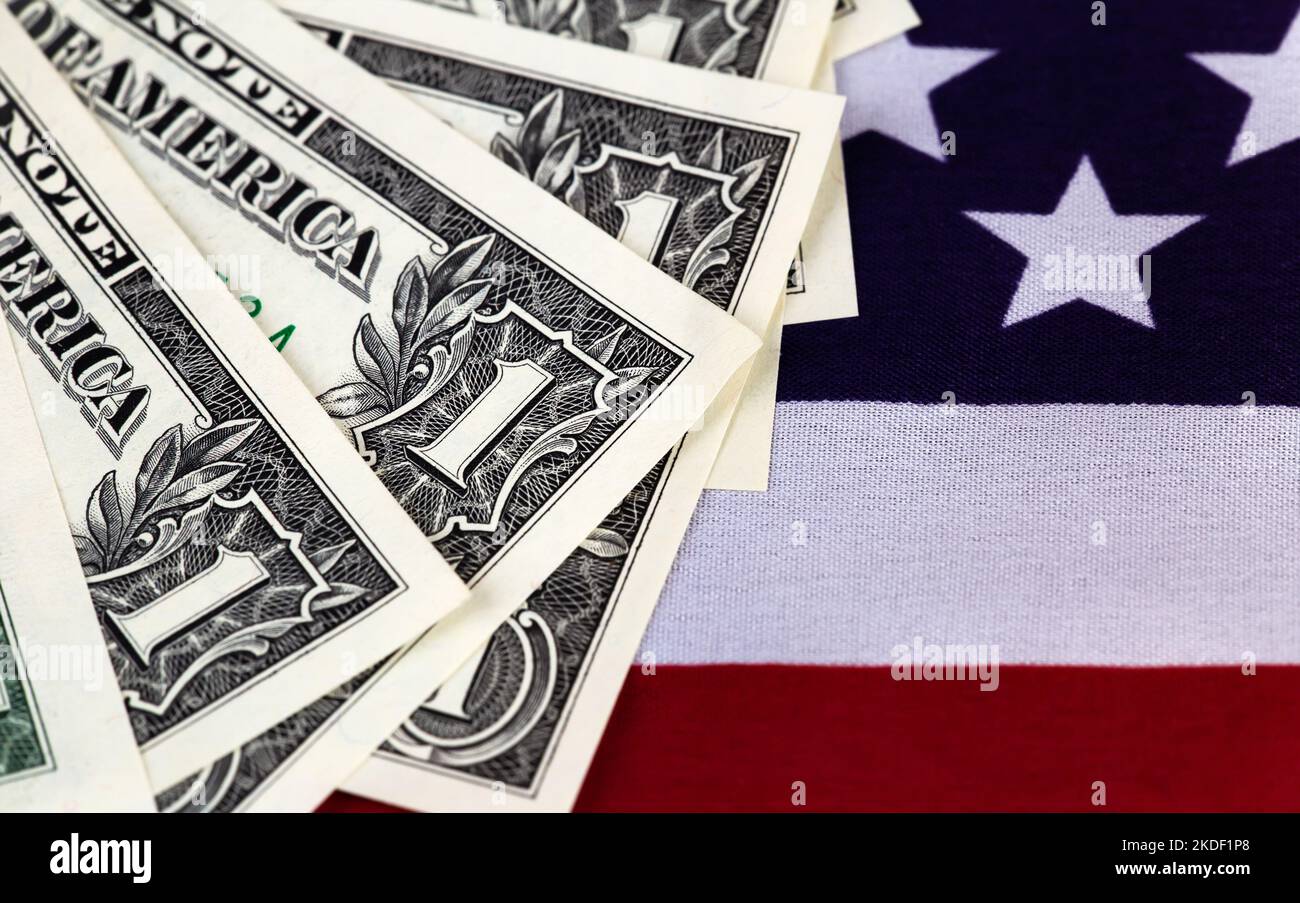 US dollar bills on a flag. Inflation, finance or money savings ...