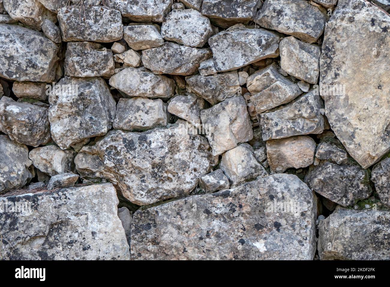 Texture of wall surface made of unevenly cut Jerusalem stones. Isarel ...