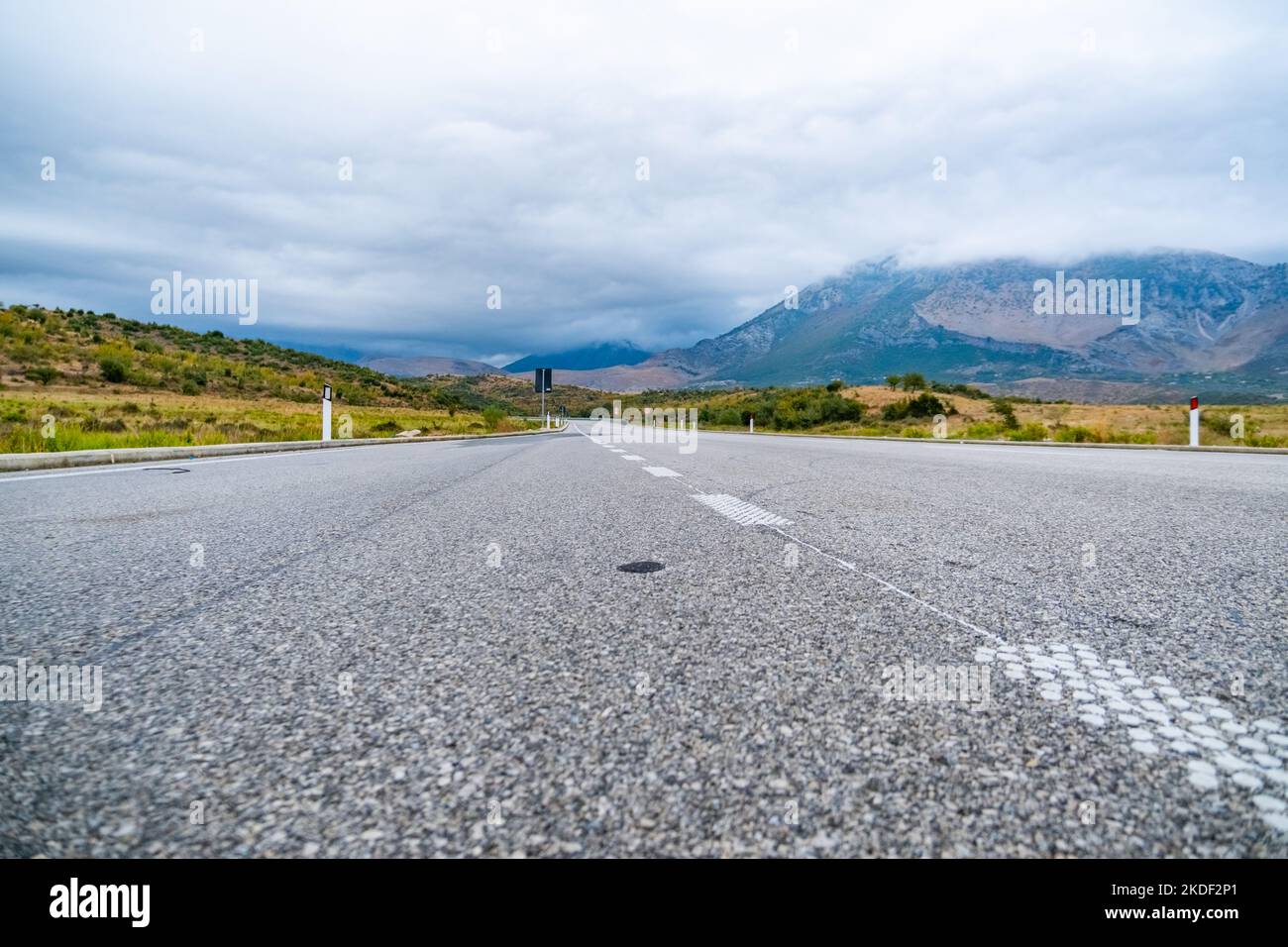 Passing road with markings in Albania Stock Photo - Alamy