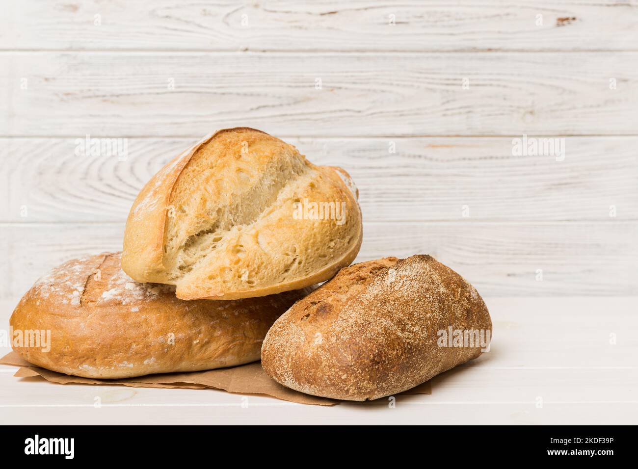 Homemade natural breads. Different kinds of fresh bread as background ...
