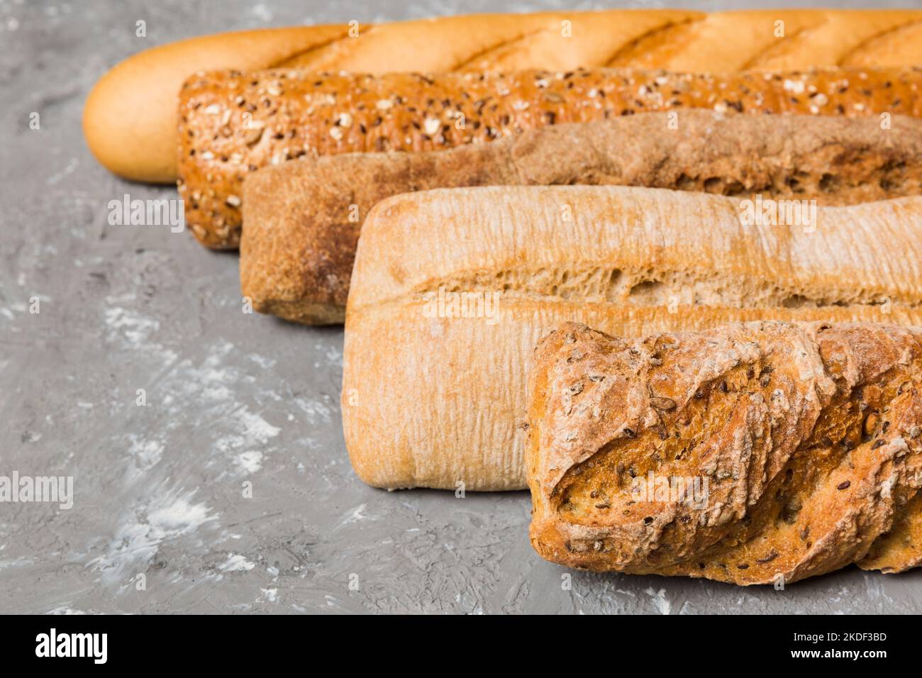 Homemade natural breads. Different kinds of fresh bread as background ...