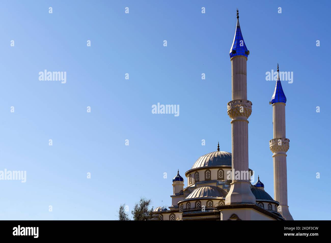 Architecture of the Islamic mosque in Turkey against the sunny blue sky ...