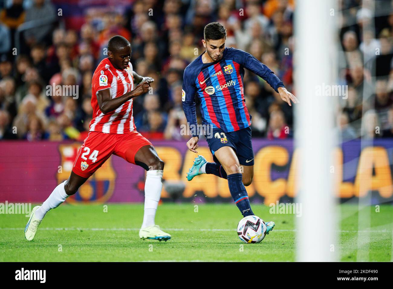 Ferran Torres of FC Barcelona and Mendes of UD Almeria in action during ...