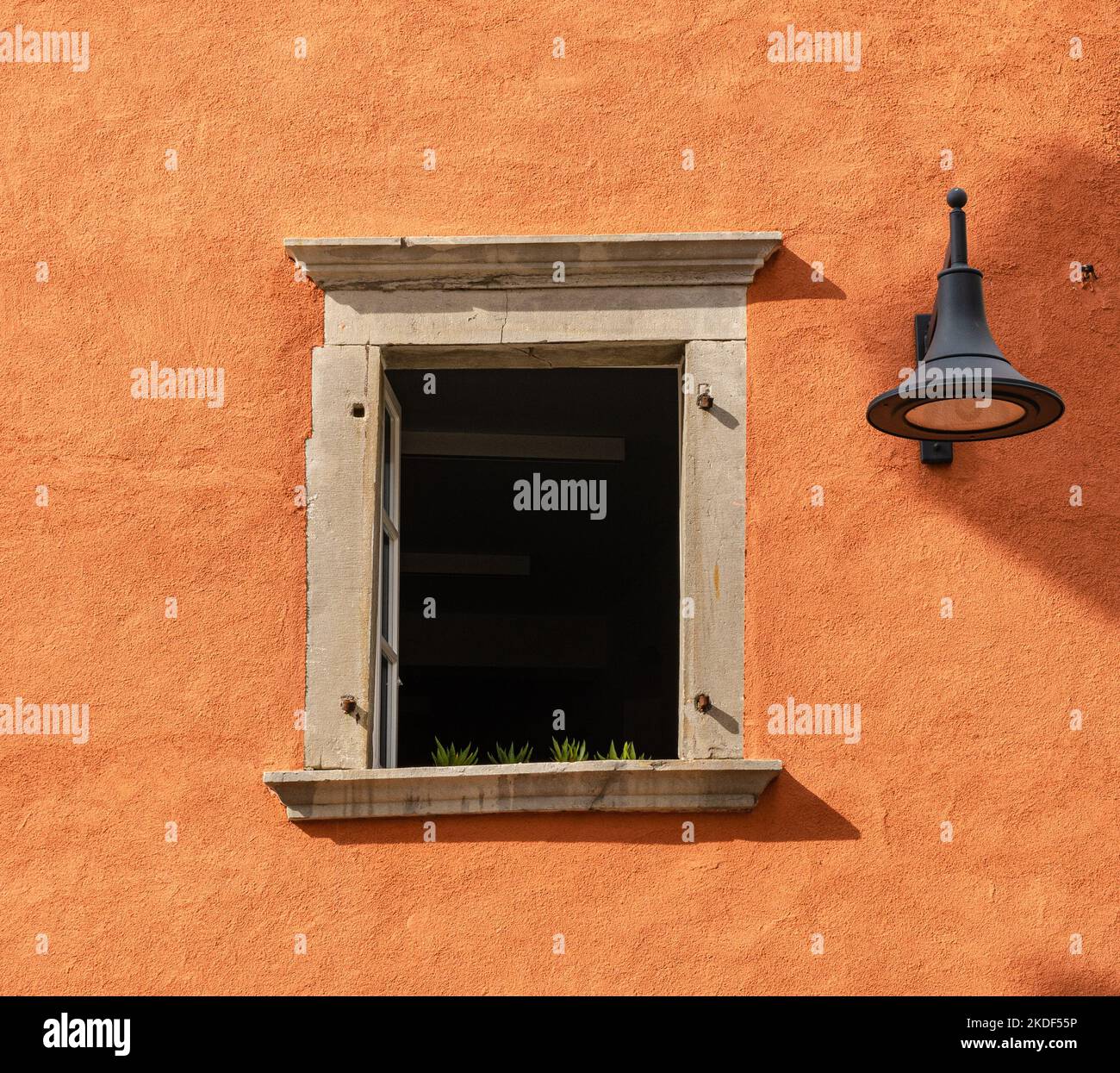 A detail of a window and a lamp. Beautiful Italian architecture and ...