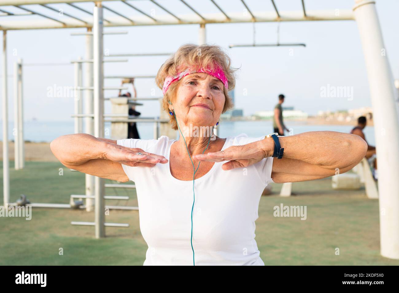 Old woman doing fitness exercises outdoors Stock Photo - Alamy