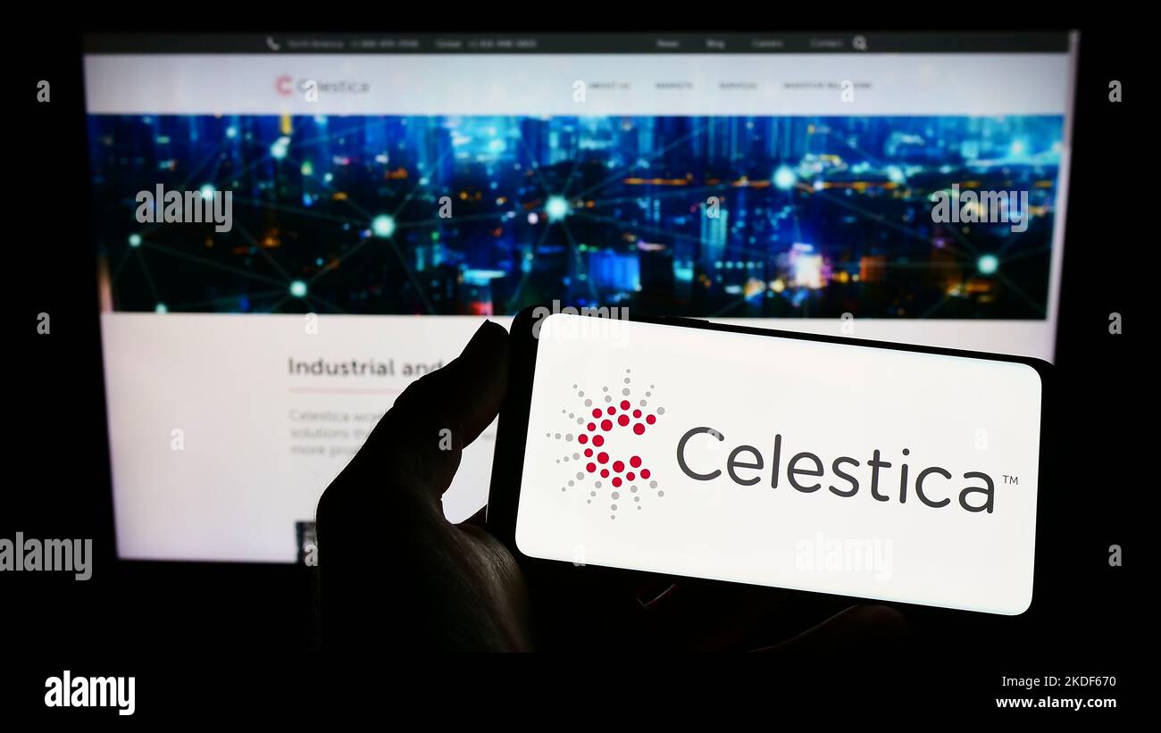 Person holding cellphone with logo of Canadian electronics company ...