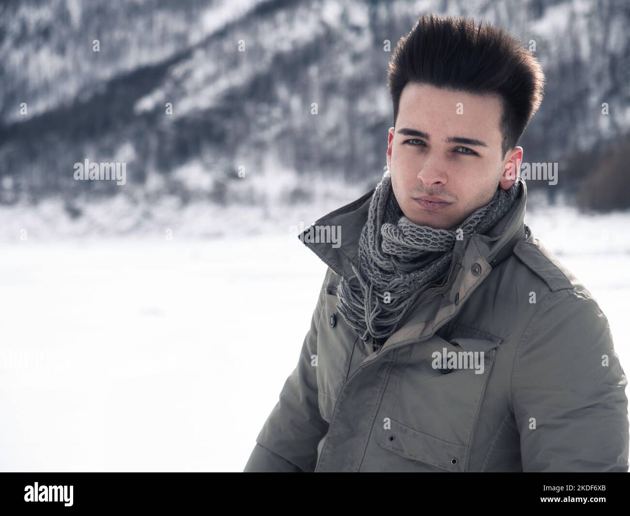 Young man in the mountain in winter with snow Stock Photo - Alamy