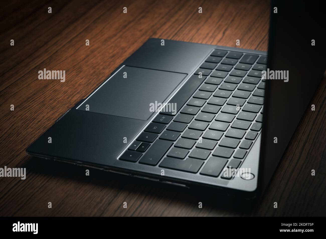 Closeup image of wood desk with modern laptop. Business and finance ...