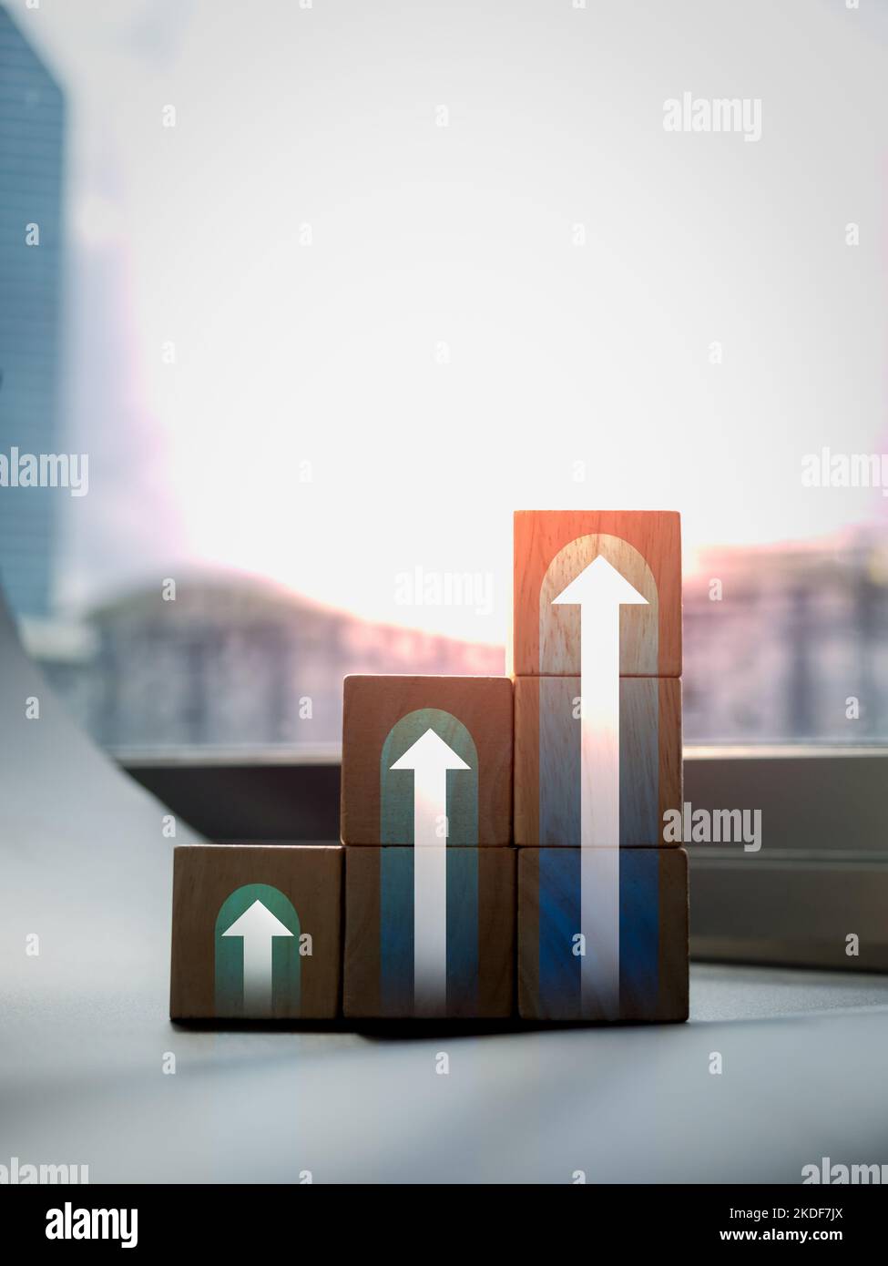 Rise up arrows on wooden blocks, 3d bar graph chart steps on building ...