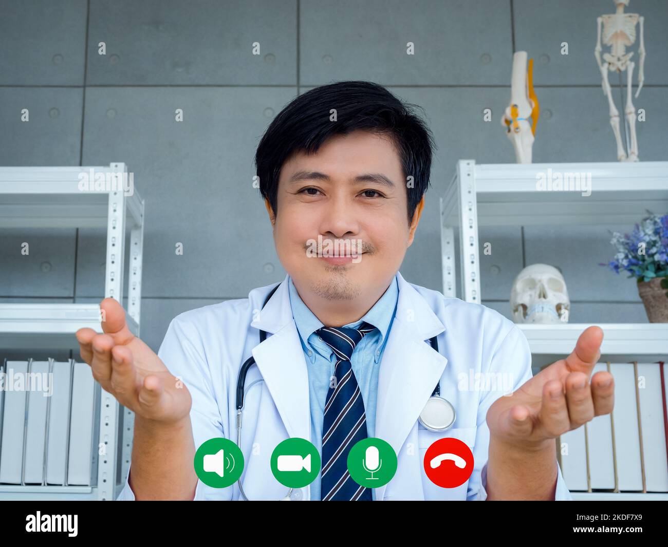 Asian man orthopedic doctor looking at camera on webcam screen with video call icons, online ...