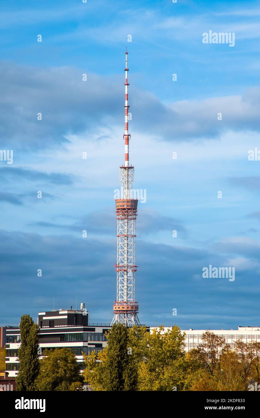 TV tower in Kyiv Ukraine. Autumn landscape. Blue sky and yellow trees ...