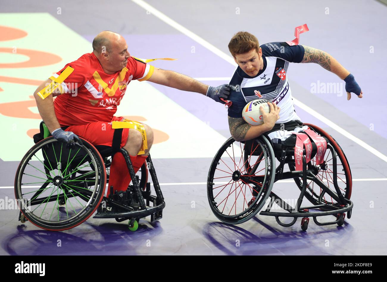 Spain's David Raymond (left) and England's James Simpson in action ...