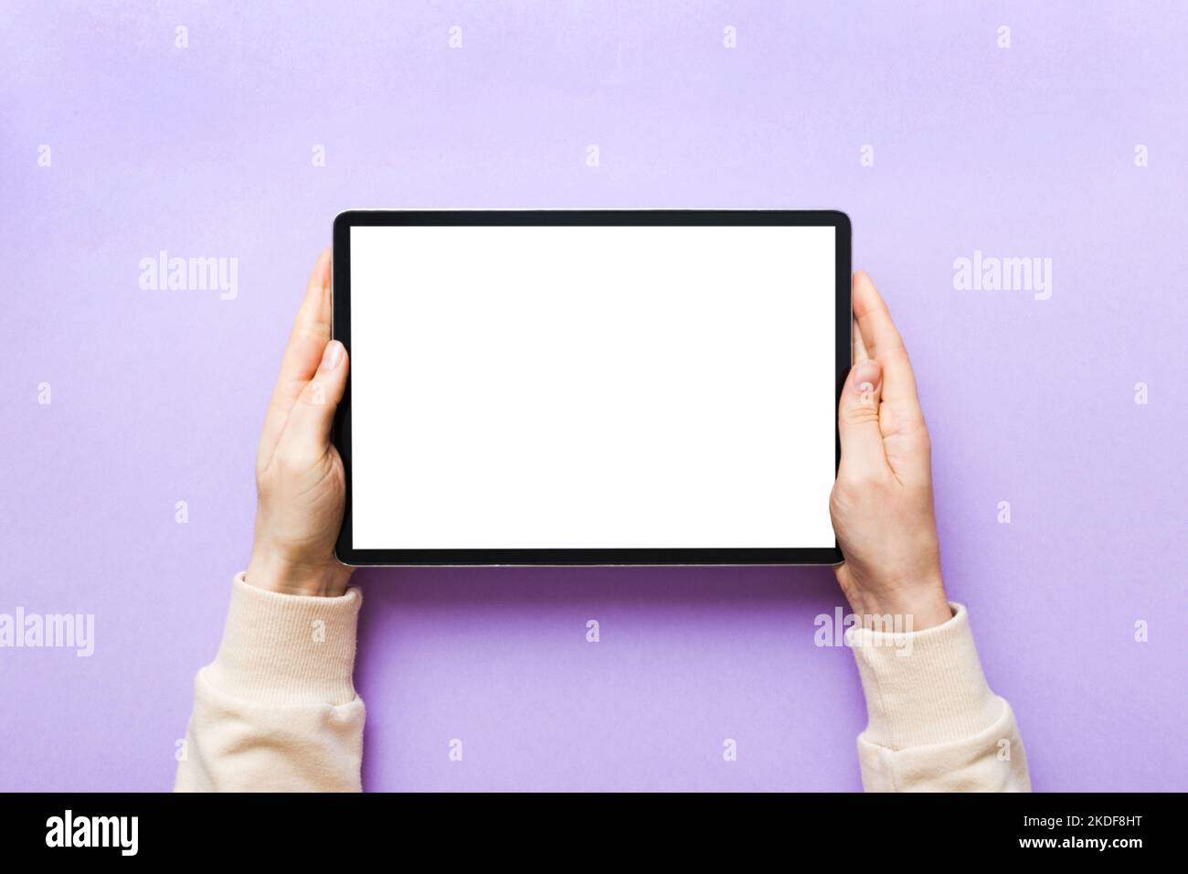 female teen hands using tablet pc with white screen, Mockup image of ...