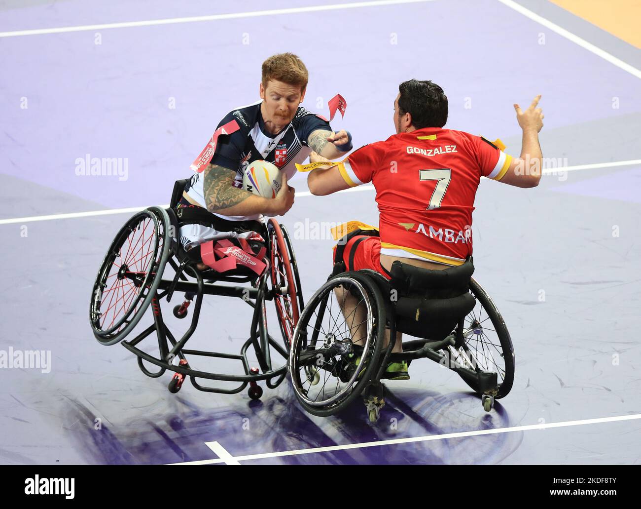 England's James Simpson (left) and Spain's Theo Gonzalez in action ...