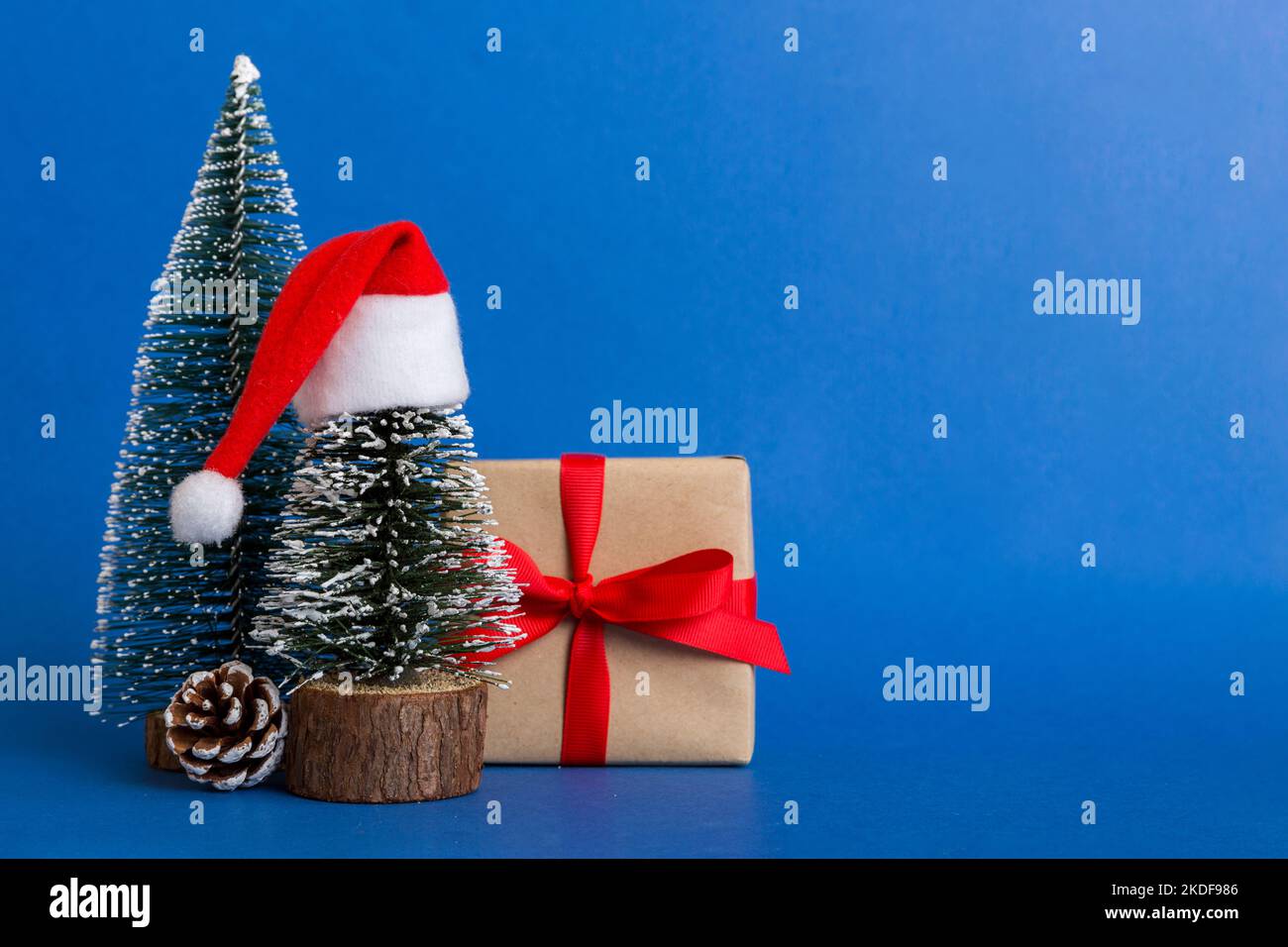 Christmas composition. craft Gift box, small tree, branches and craft ...