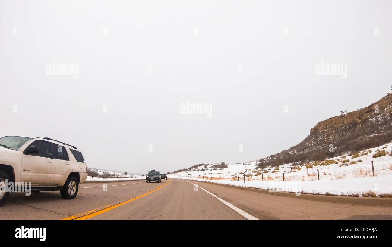 Driving in suburban area Stock Photo - Alamy