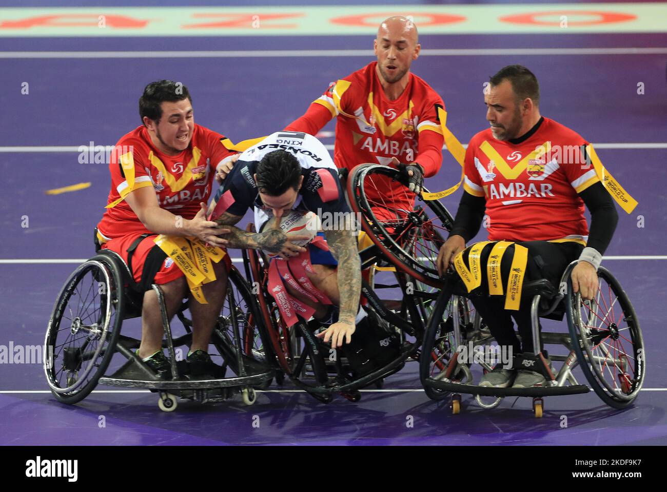 England's Lewis King (centre) in action with Spain's Theo Gonzalez ...