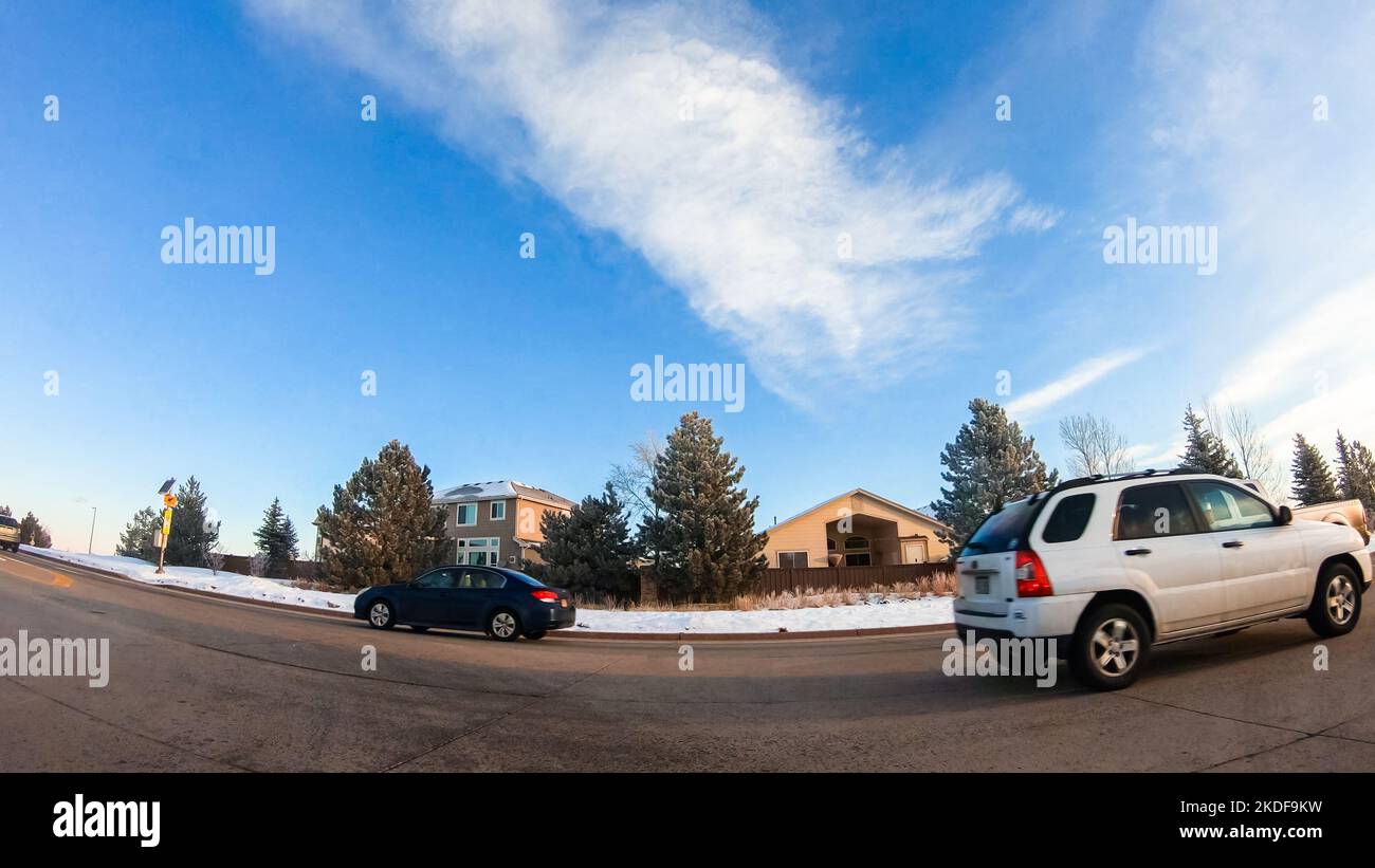 Driving in suburban area Stock Photo - Alamy