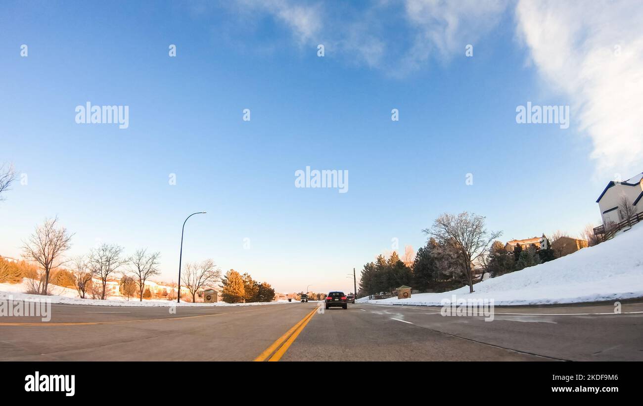 Driving in suburban area Stock Photo - Alamy