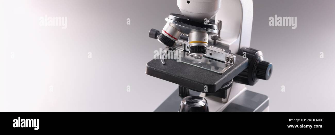 Modern microscope tool for laboratory research on grey background Stock ...
