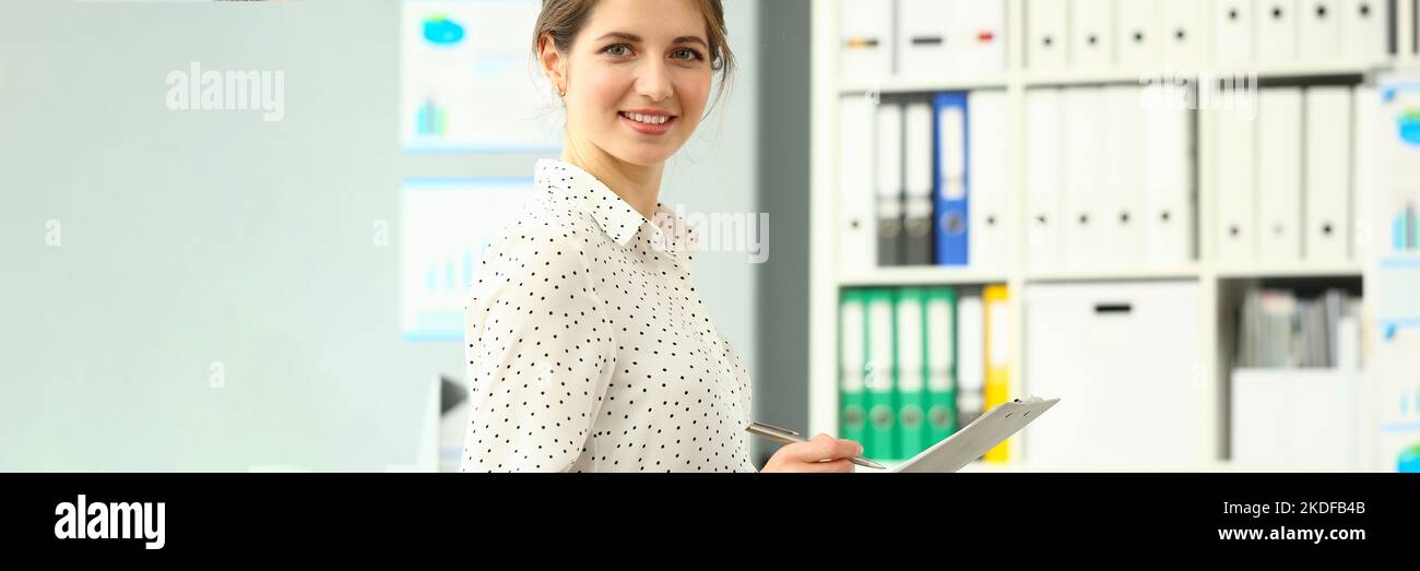 Cute smiling woman posing in conference room Stock Photo - Alamy