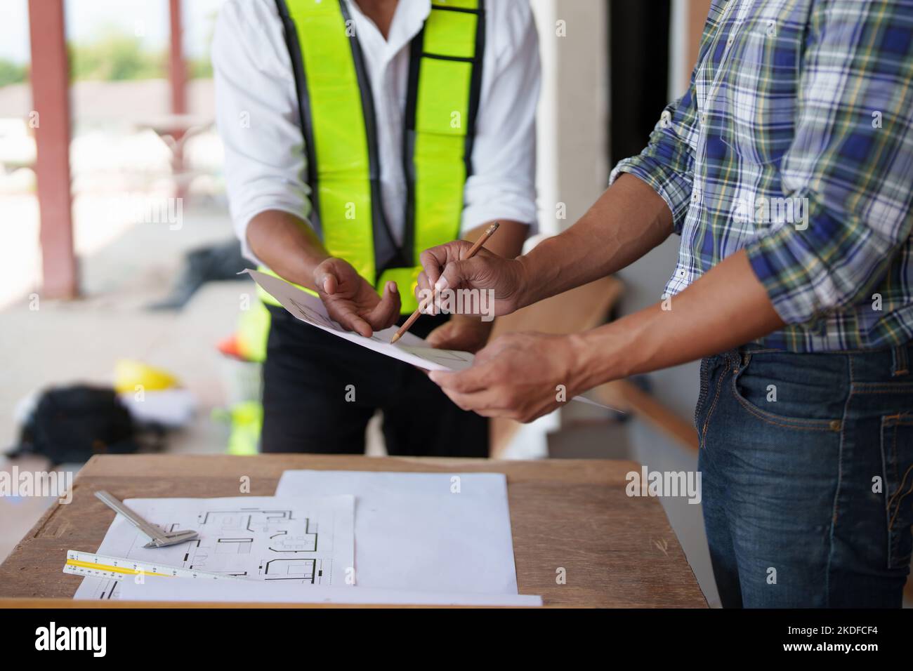 Architect team working with blueprints for architectural plan, engineer ...