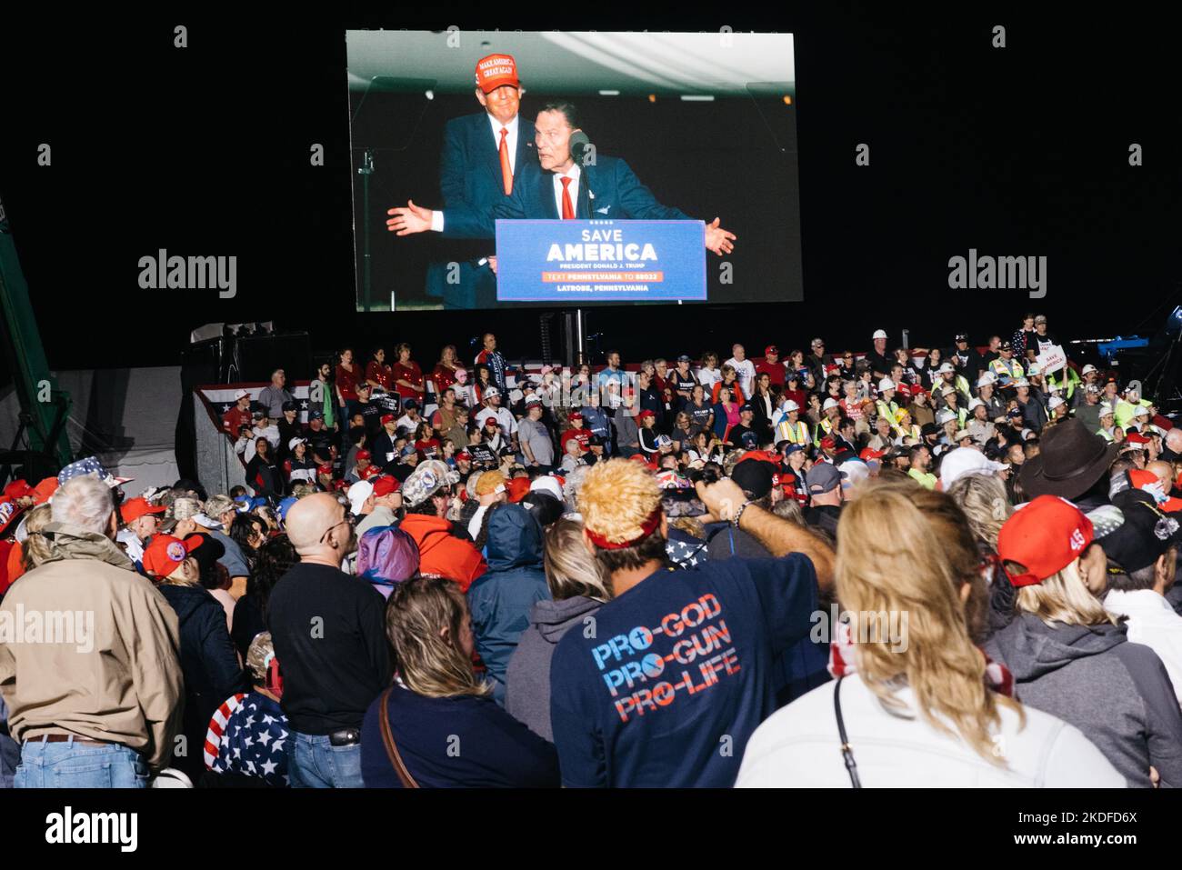 Visitors watch the speech of televangelist Kenneth Copeland, a guest ...