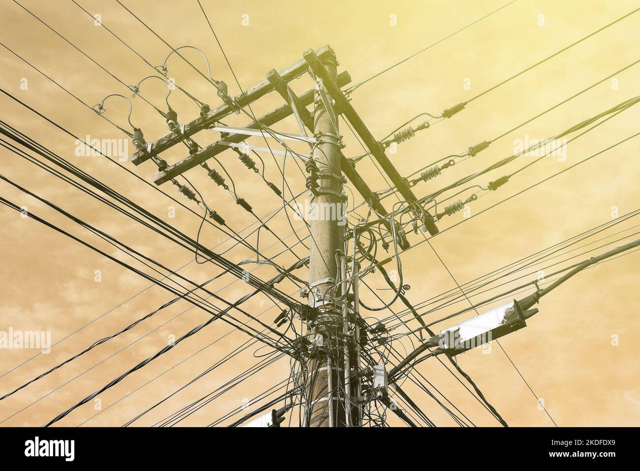 concrete pole with electrical power, telephony and fiber optic cabling ...