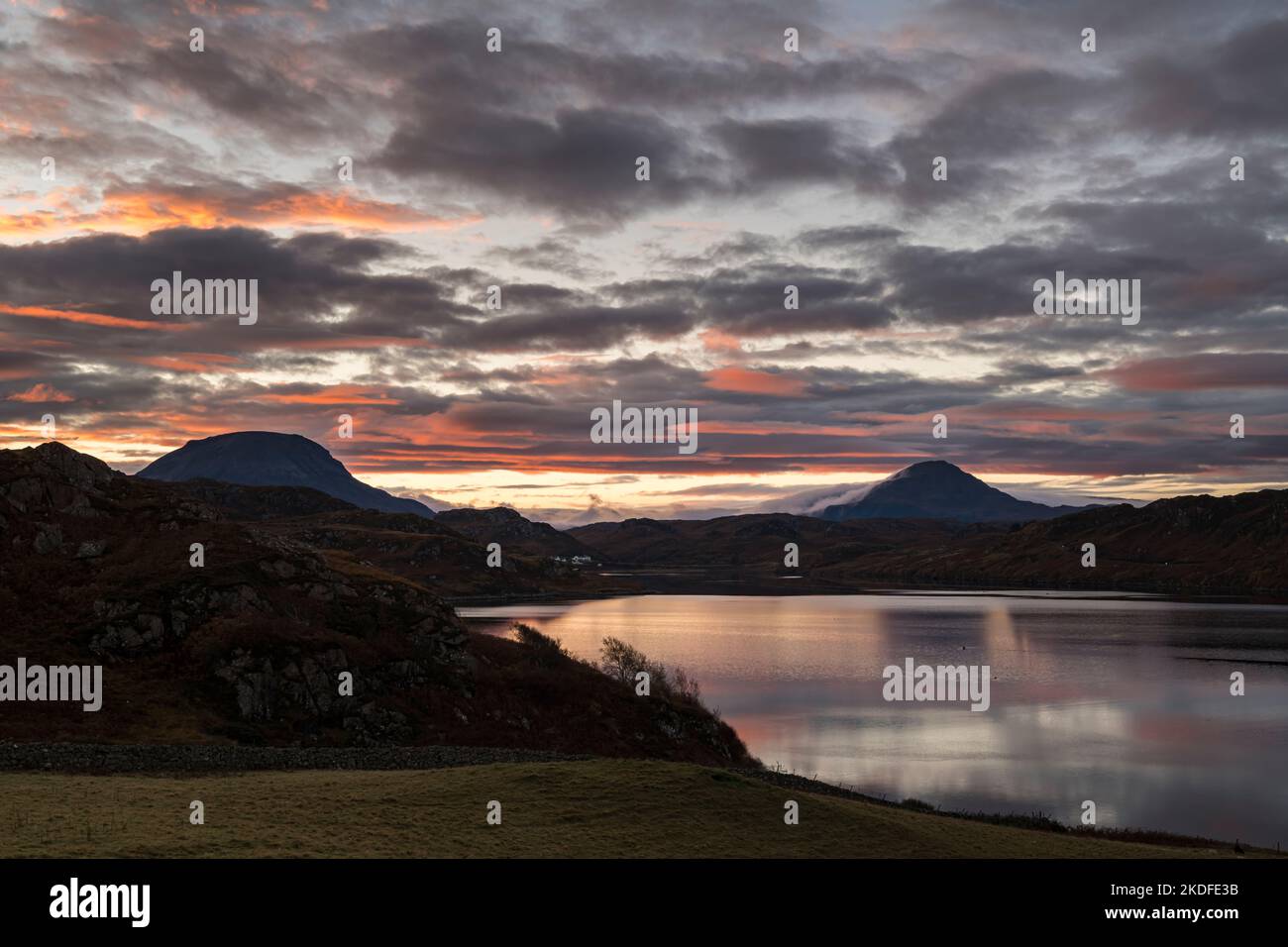 A HDR image of a cloudy, autumnal dawn over Loch Inchard with Arkle and Ben Stack in the ...