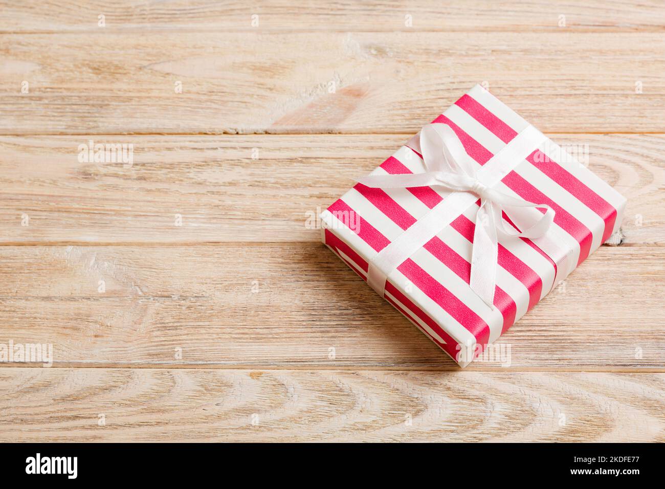 wrapped Christmas or other holiday handmade gift box in color paper ...