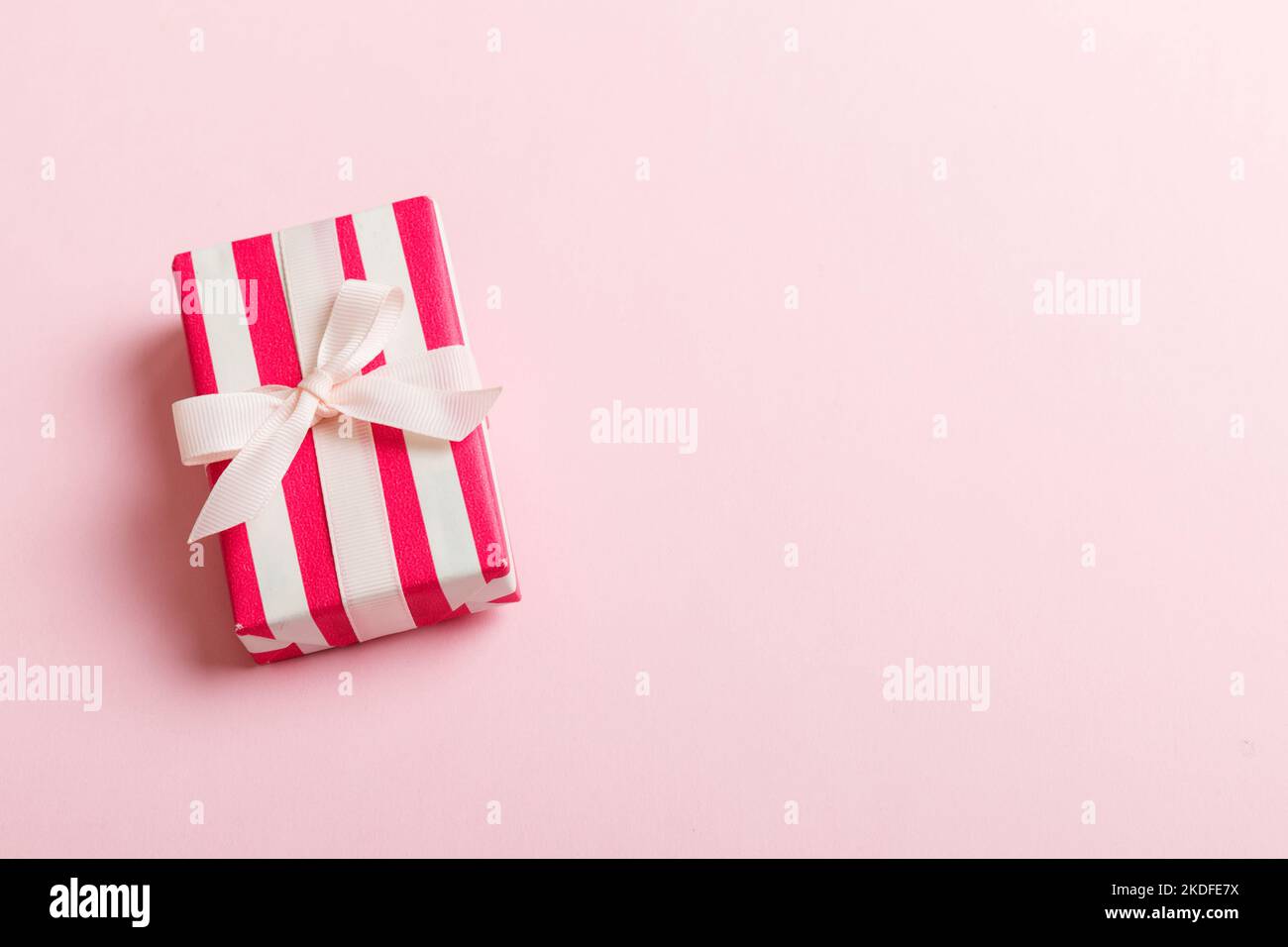 wrapped Christmas or other holiday handmade gift box in color paper ...