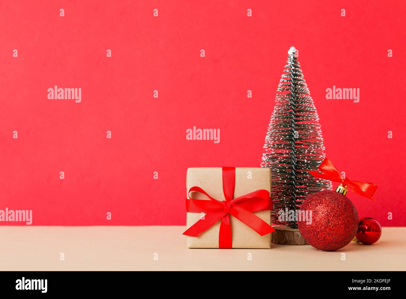 Christmas composition. craft Gift box, small tree, branches and craft ...