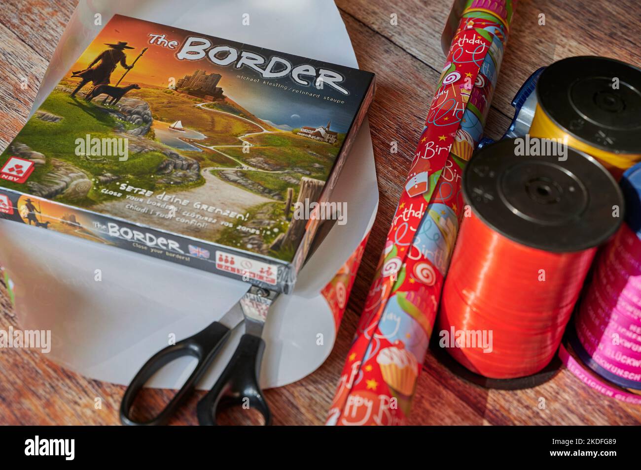 Berlin, Germany - September 25, 2022: Board game with wrapping paper ...