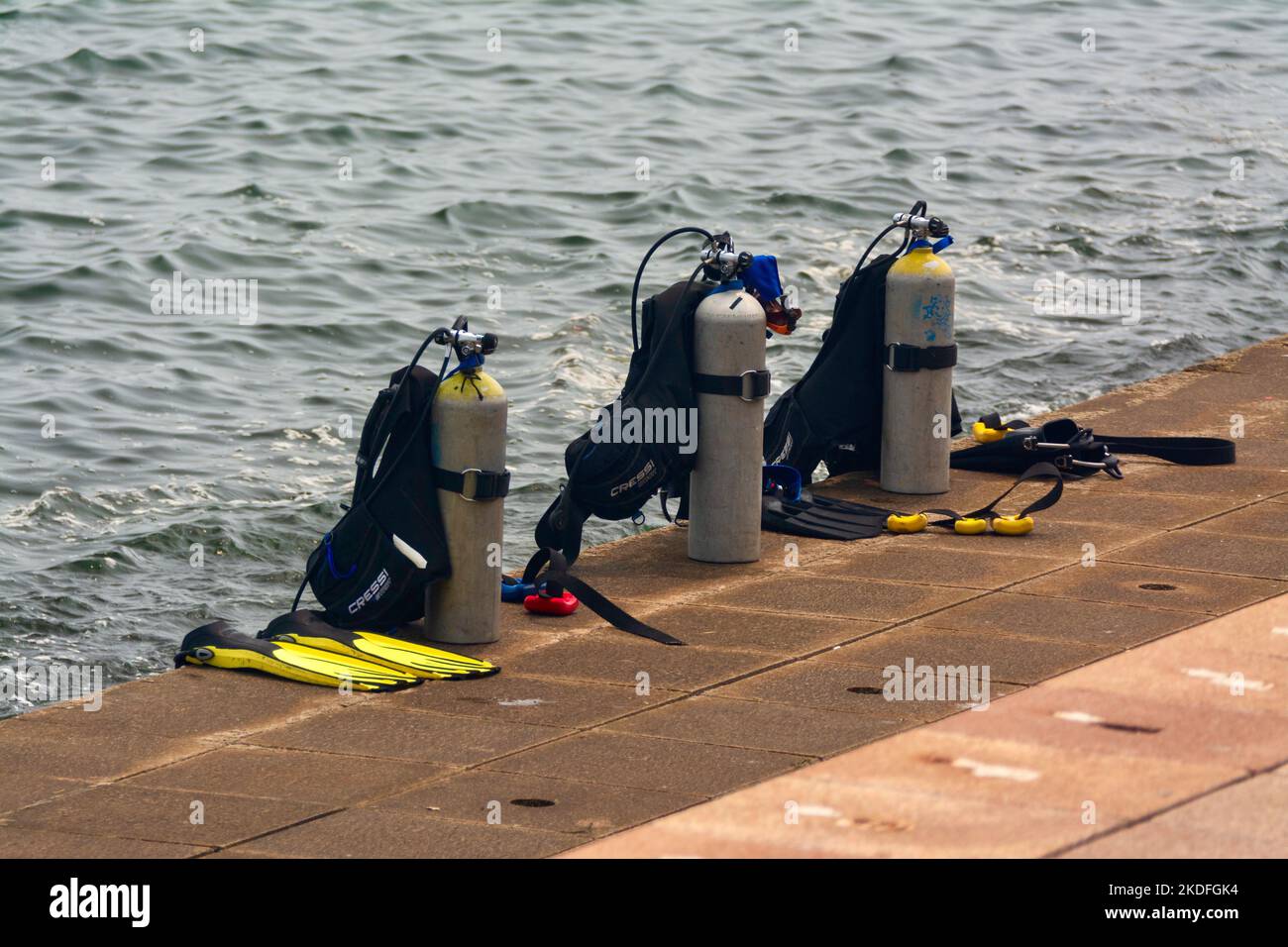 A bunch of diving equipment on a platform by the sea Stock Photo - Alamy