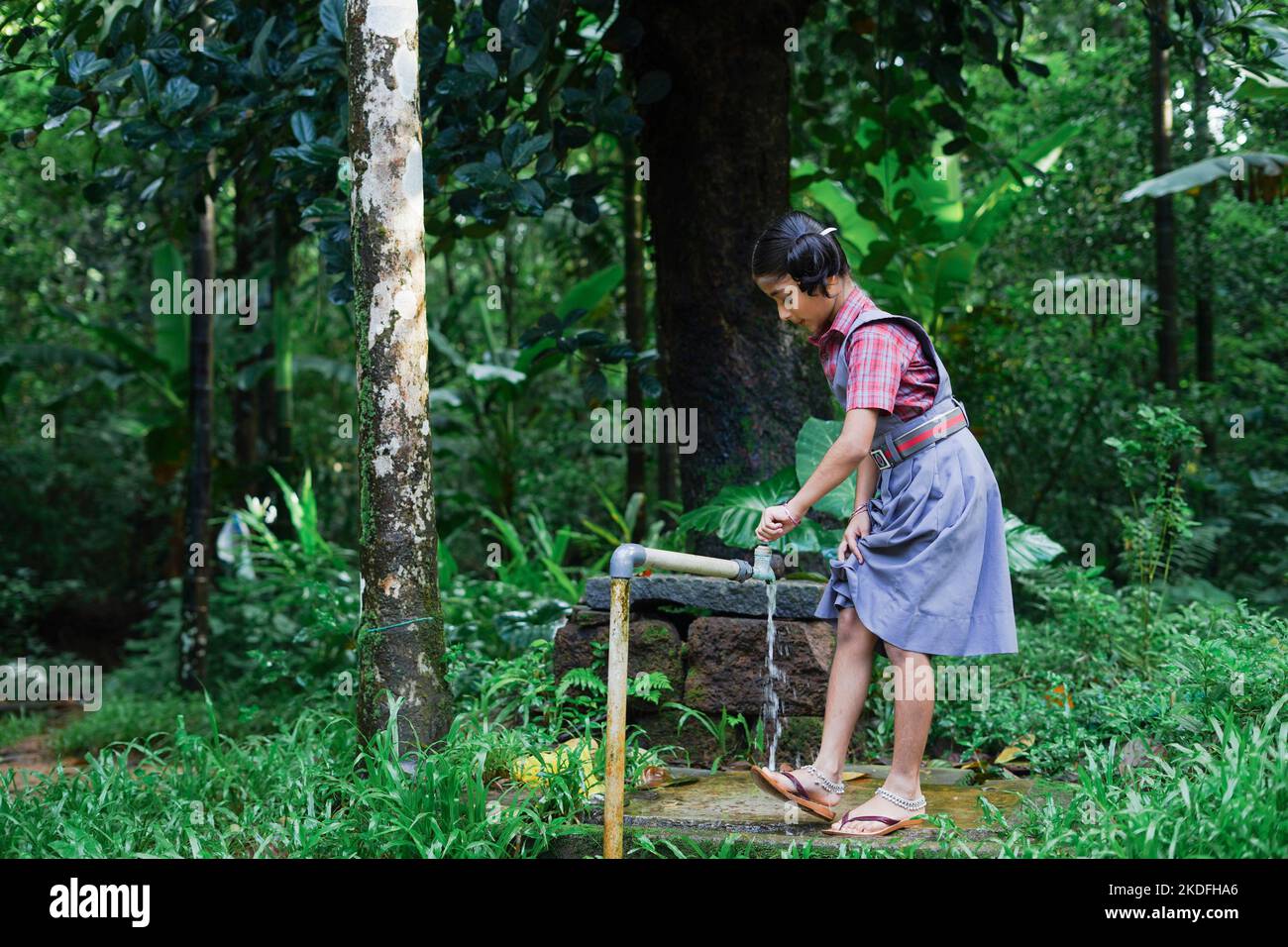 Girl washing feet hi-res stock photography and images - Alamy