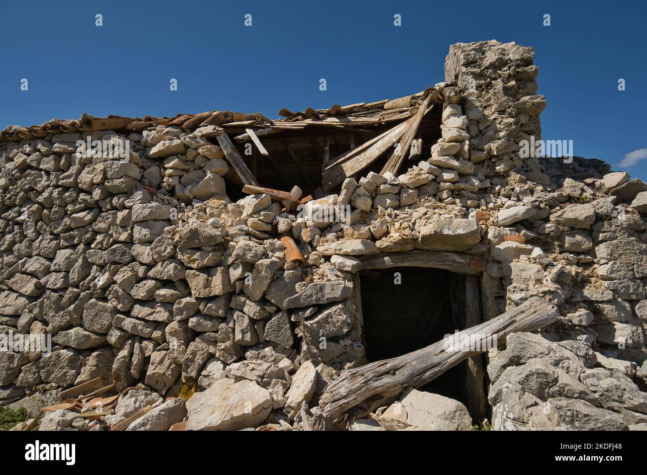 A partially collapsed roof on an old stone house Stock Photo - Alamy