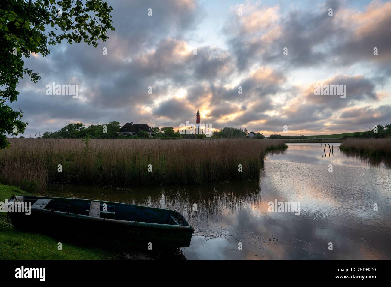 The Pellworm lighthouse at sunrise in North Frisia, Germany Stock Photo ...