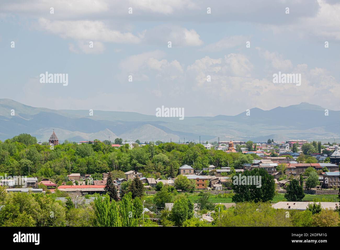 The beautiful skyline, trees, and nearby mountains in the historic city ...