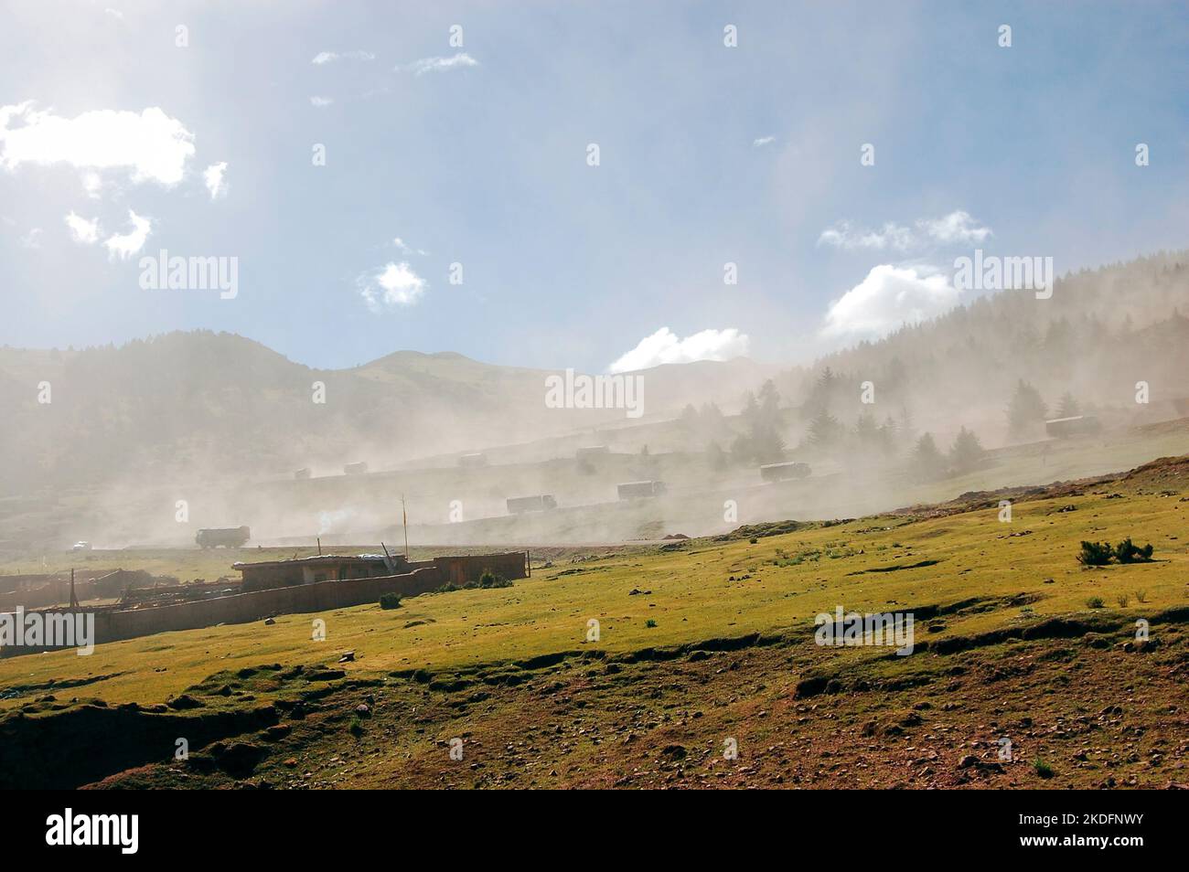 A low-angle of a dusty field with cloudy sky background Stock Photo - Alamy