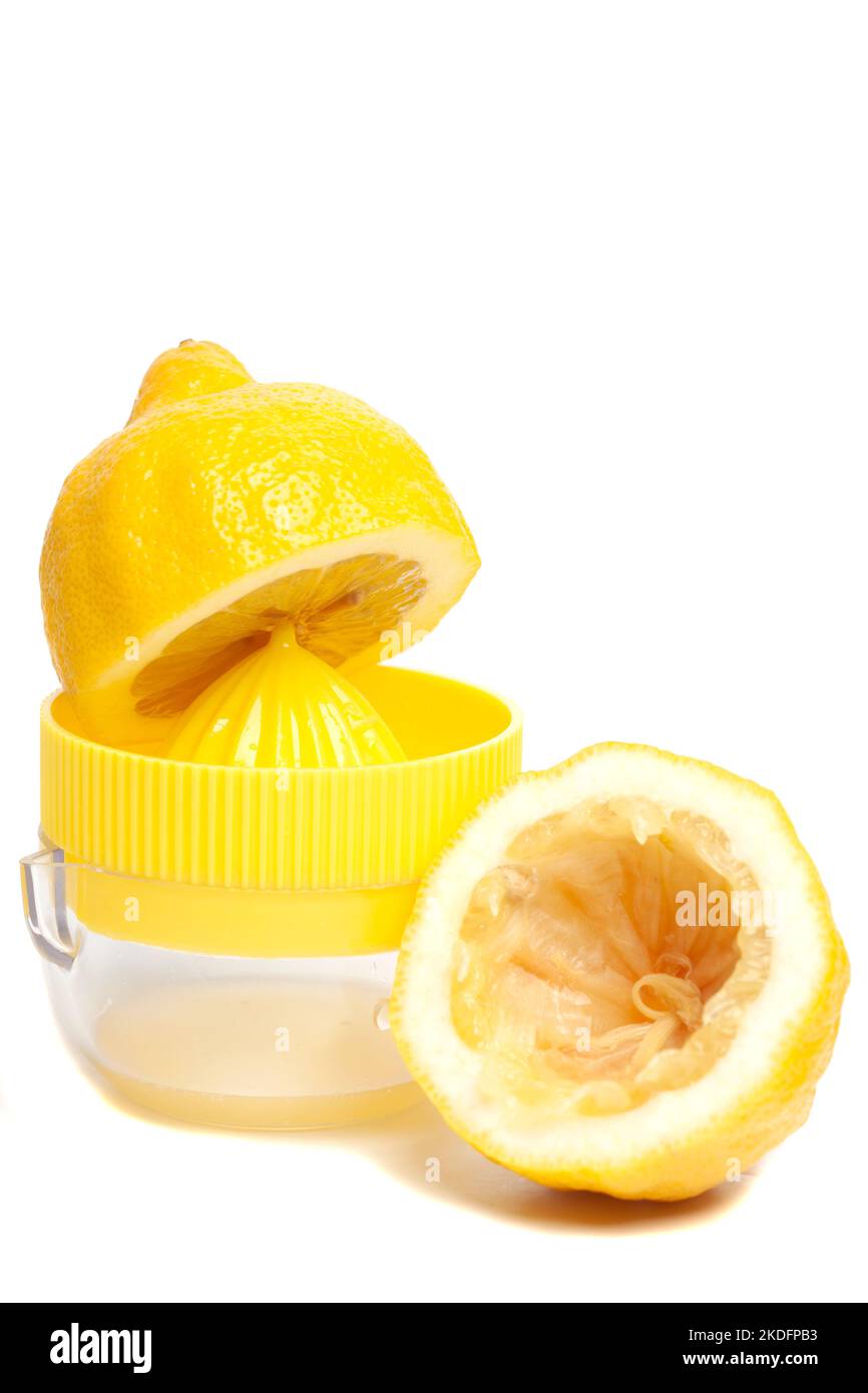 Manual Juicer with lemon isolated on white background Stock Photo - Alamy