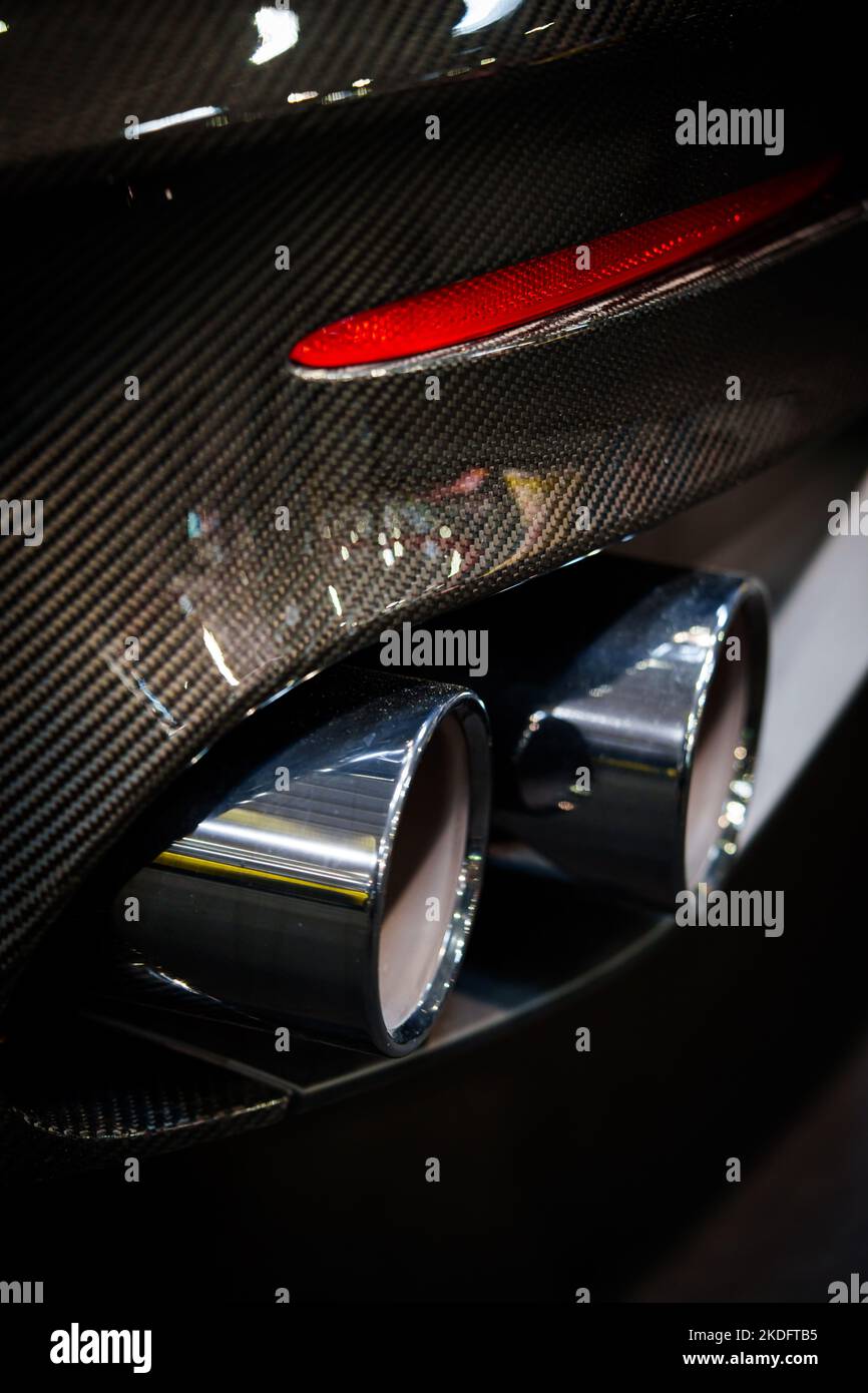 Close up shot of the rear exhaust pipe of a sports car Stock Photo - Alamy