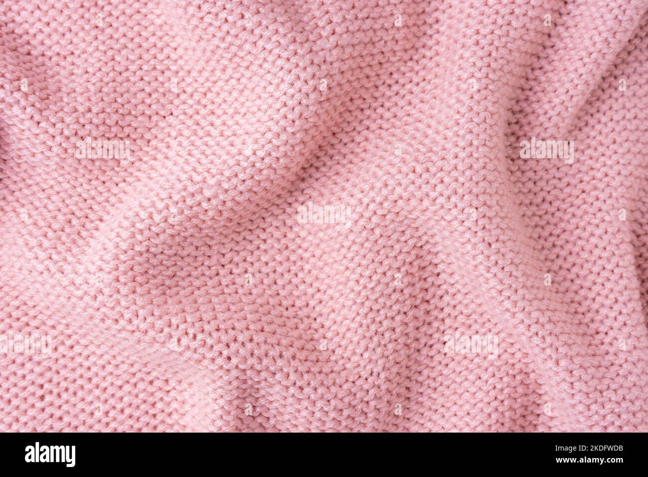 Close up background of knitted wool fabric made of viscose yarn. Bright ...