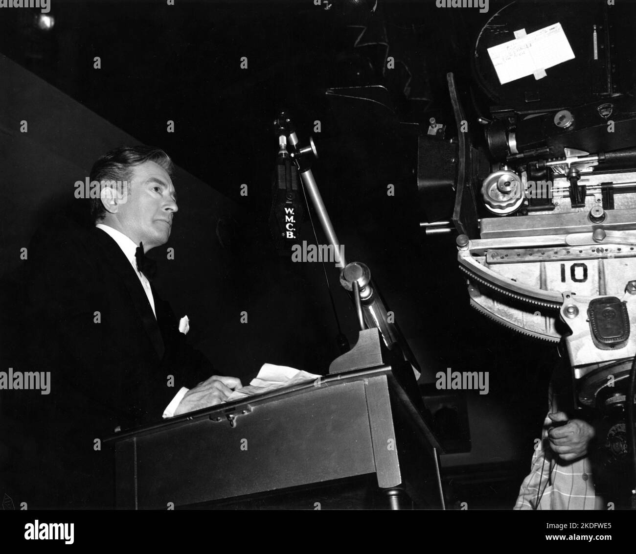CLAUDE RAINS as Radio Mystery Host Victor Grandison on set candid ...