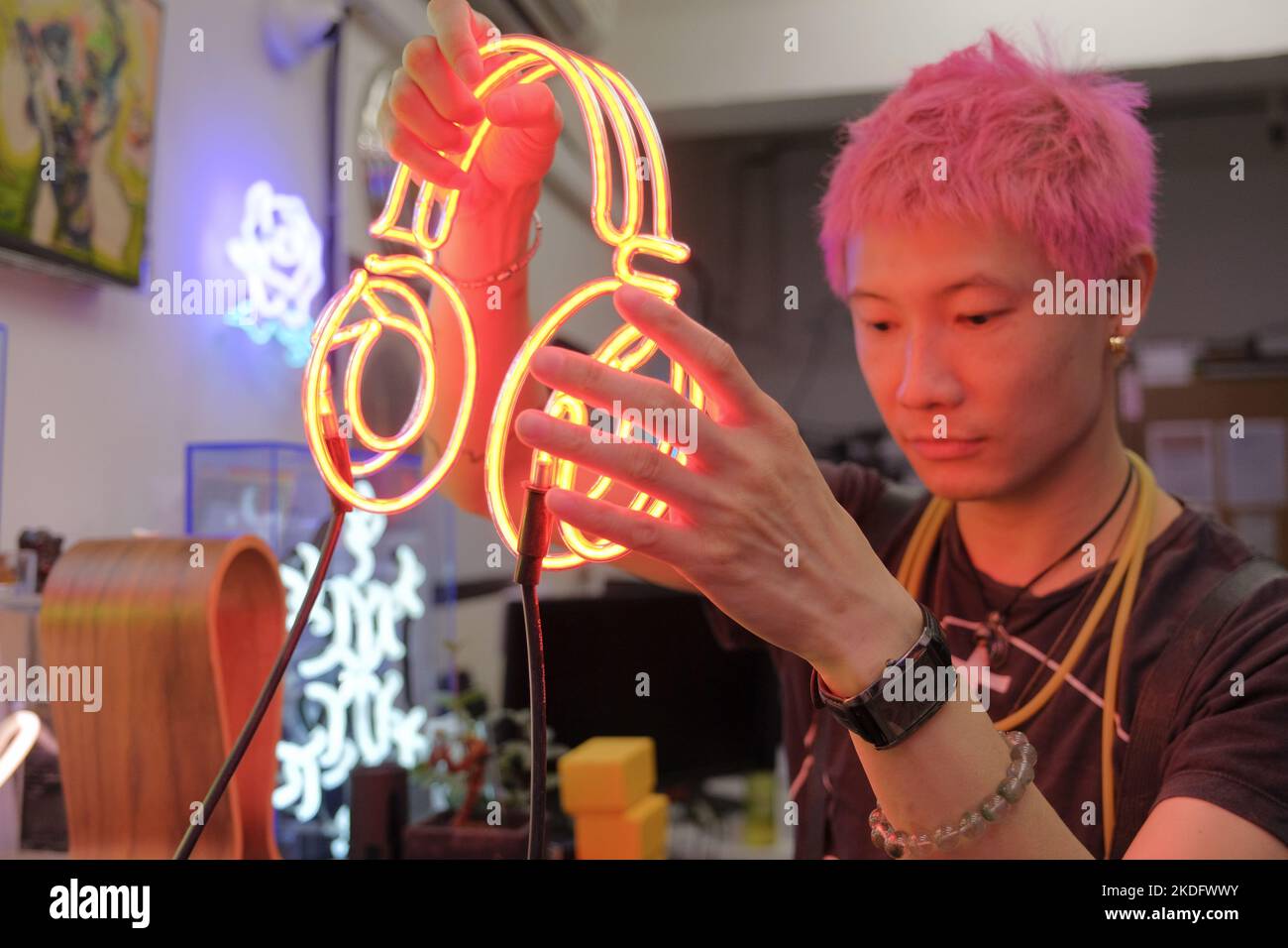 Jive Lau Ho-fai (pink hair) teaches a neon bending workshop to writer ...
