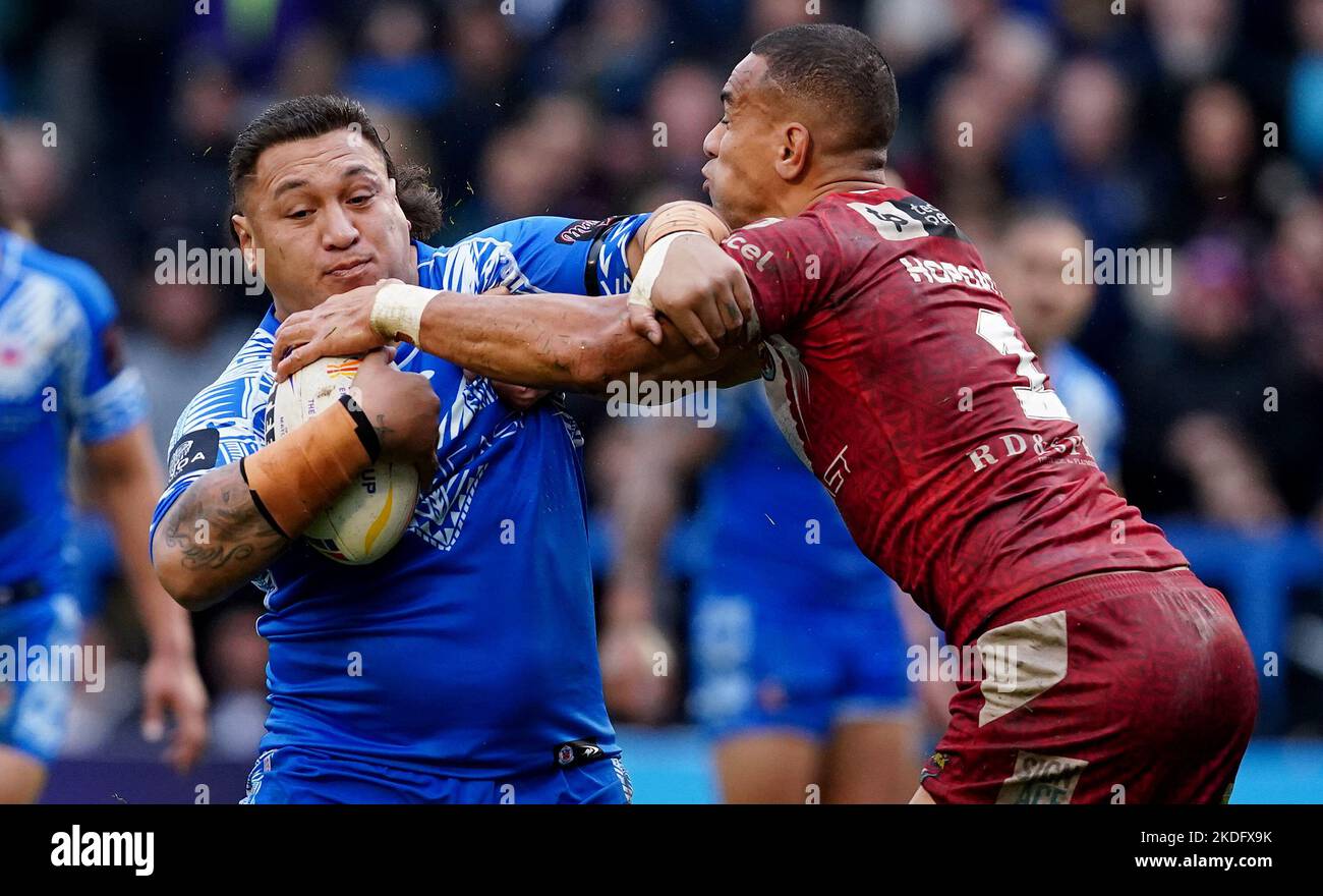 Samoa's Josh Papali'i is tackled by Tonga's Will Hopoate, during the ...